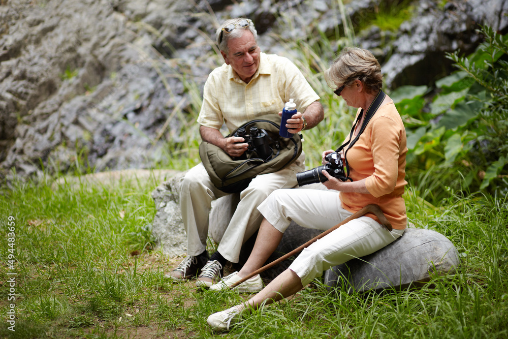 Time for some refreshments. A loving senior couple stopping for a water ...