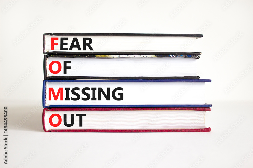 FOMO fear of missing out symbol. Concept words FOMO fear of missing out ...