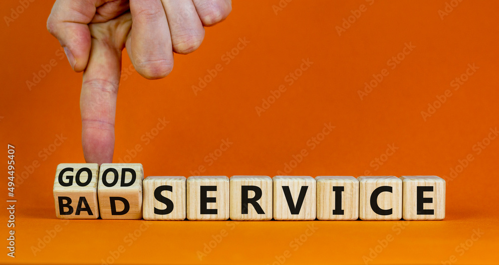 Good or bad service symbol. Businessman turns cubes and changes words ...