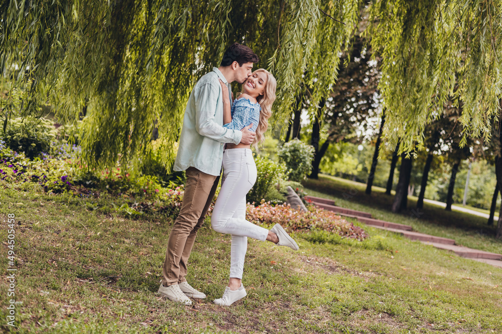 Full length body size view of two attractive cheerful amorous couple ...