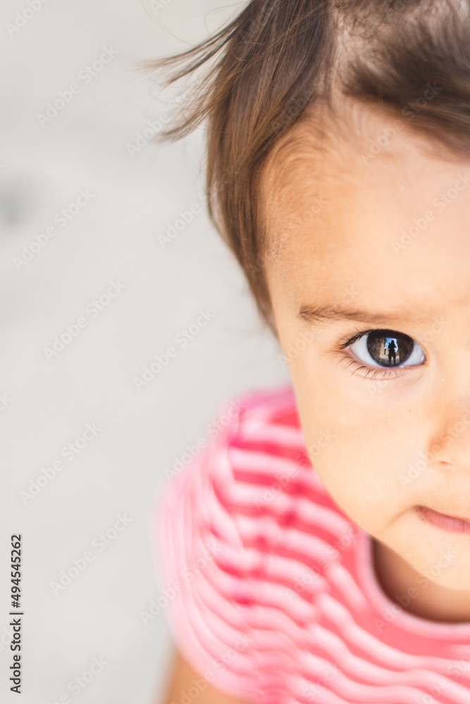 Top view portrait of a beautiful little girl. Half face portrait. Stock ...