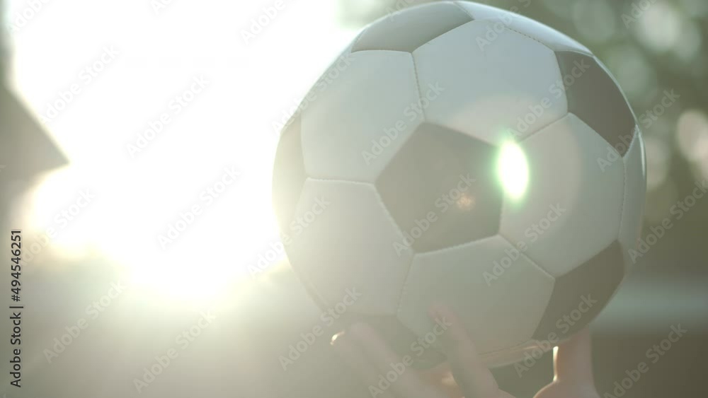 Vídeo do Stock: Close-up soccer ball in child hand in sunrays outdoors ...