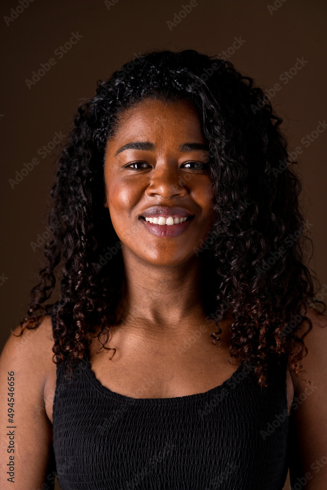 Mid Waist Portrait Of African American Woman With Dark Hair And White