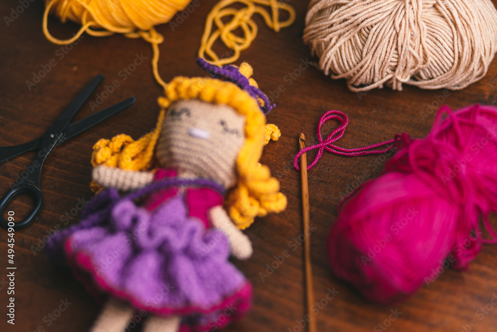 Product photo of a handmade crochet toy doll for kids with its tools ...