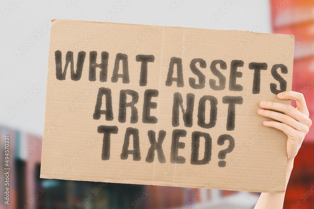 The question " What assets are not taxed? " on a banner in men's hands ...