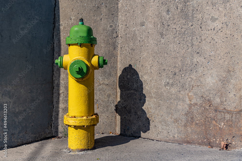 Yellow Fire Hydrant near a Concrete Corner Stock Photo | Adobe Stock