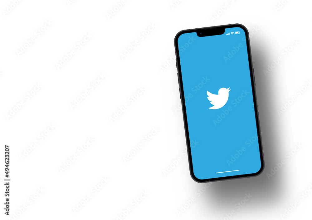 Twitter app on smartphone screen with large shadow giving the feeling ...