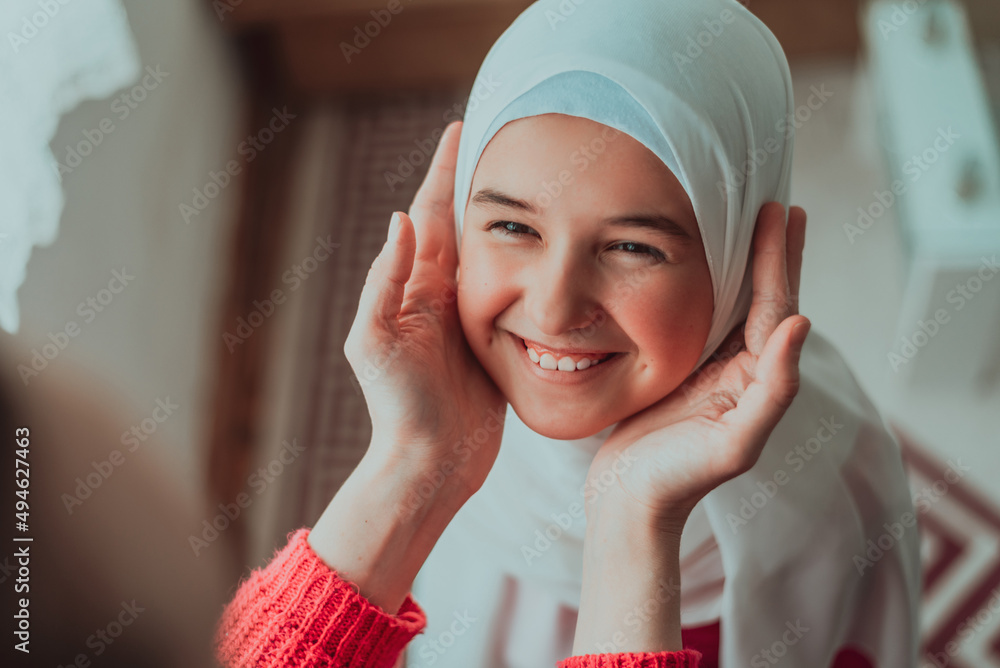 Happy Muslim family. Mother holding child daughter in her hand. Mom and ...