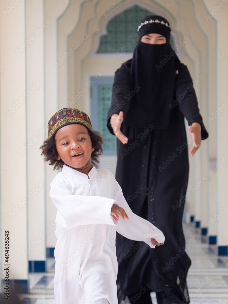 Cute little Muslim boy running away from Asian mother ,wearing black ...