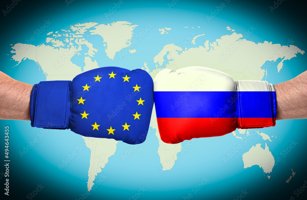 Men in boxing gloves with European union and Russian flags fighting ...