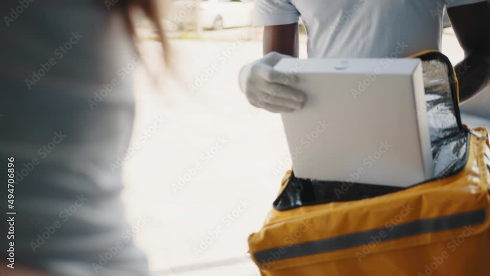 Close-up hand of people carry, send or give postal mail to lady at door ...