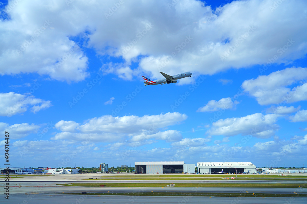 MIAMI, FL -13 MAR 2022- View of an airplane in flight from American ...