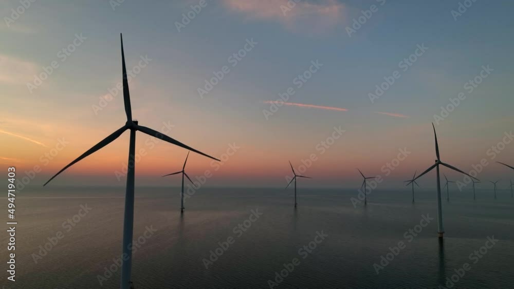 Wind turbines producing sustainable renewable energy in an offshore ...
