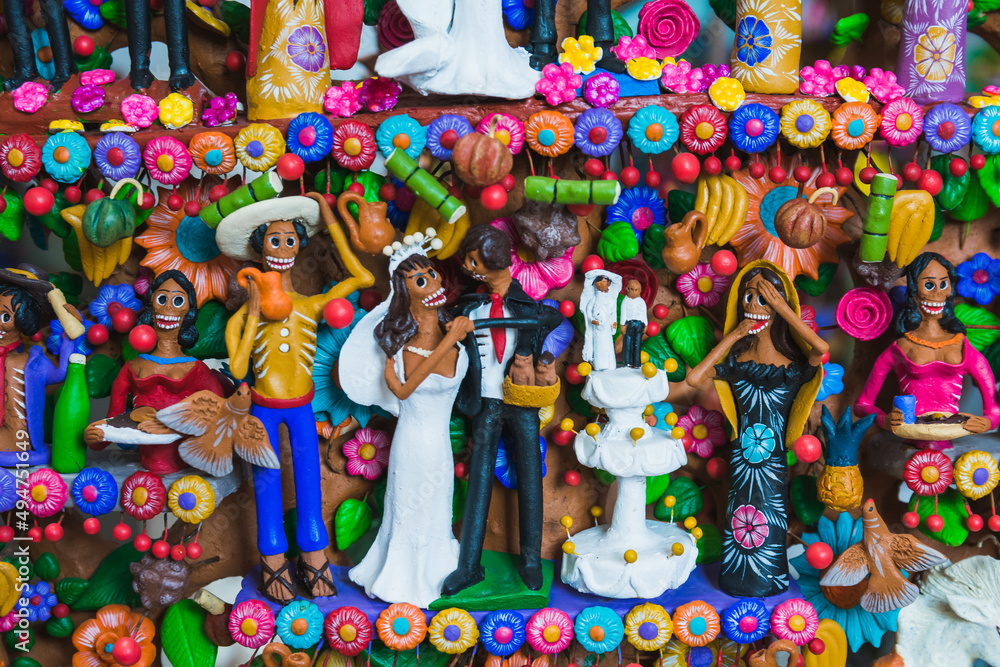Colorful clay scene of a traditional Mexican wedding with skeletons ...