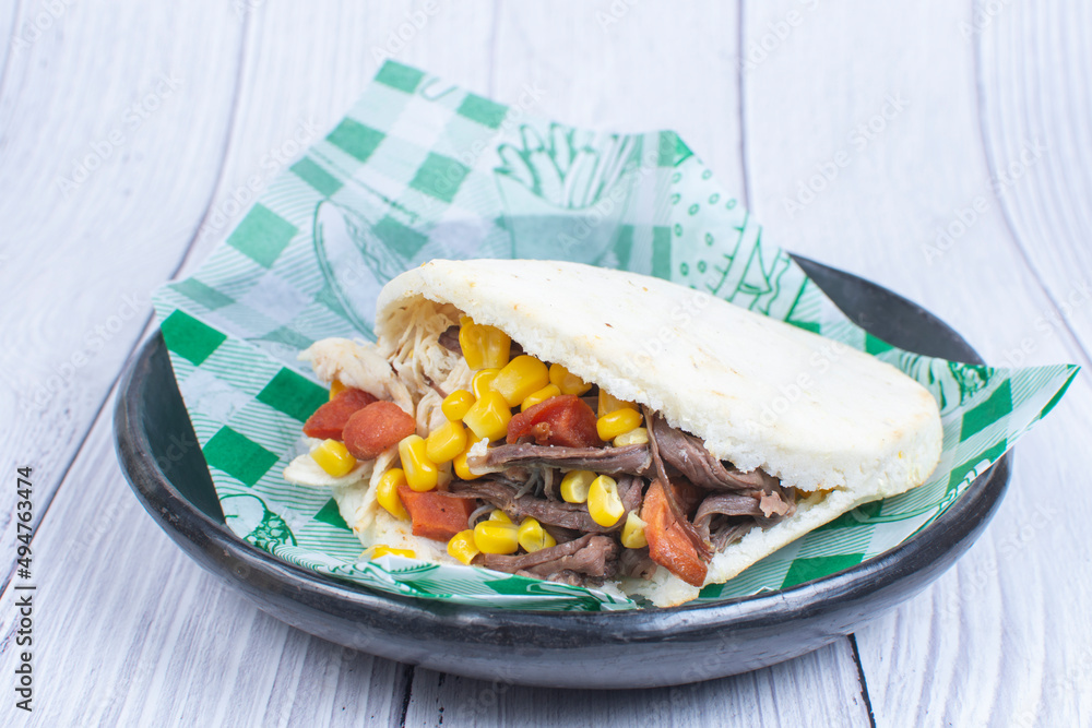 Mix of Colombian corn arepas, traditional flavors with meat, vegetables ...