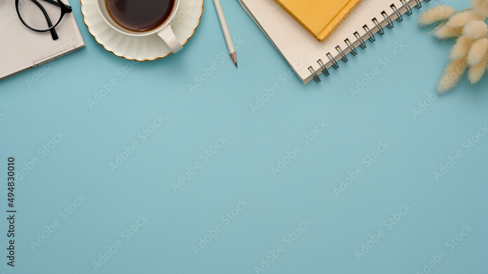 Workspace in blue background with copy space and office accessories ...