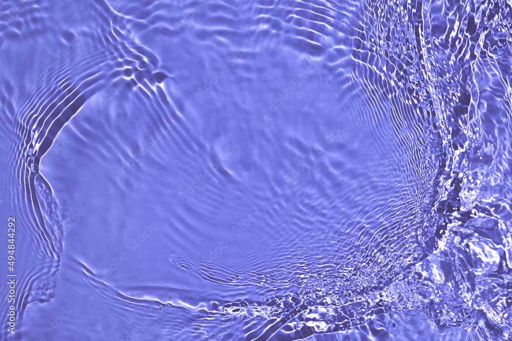 Transparent purple water surface texture with ripples, splashes and ...