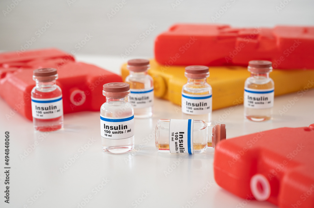 Insulin vials with cold packs against a white background: properly ...