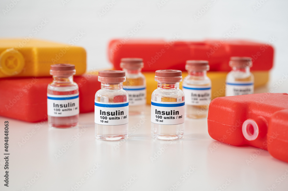 Insulin vials with cold packs against a white background: properly ...