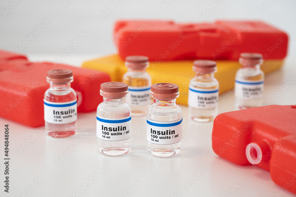 Insulin ampoules with cold packs against a white background: properly ...