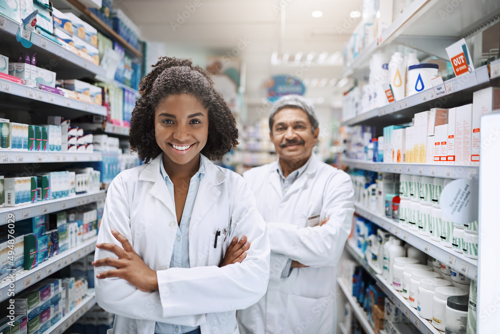 Ready to give you quality service. Cropped portrait of two pharmacists ...