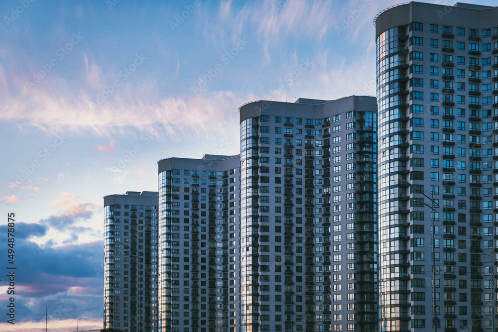 High rise curve glass building and window system on blue sky background ...