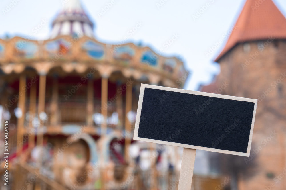 Empty mockup template Blackboard label against Carousel in amusement ...