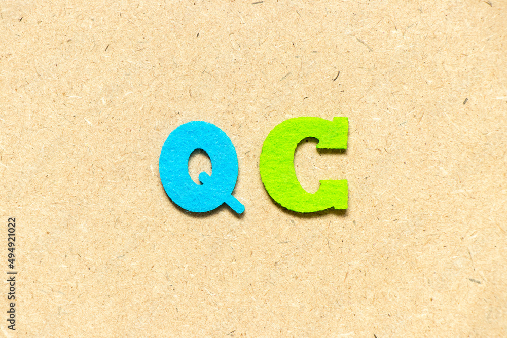 Color cloth alphabet letter in word QC (Abbreviation of Quality Control ...