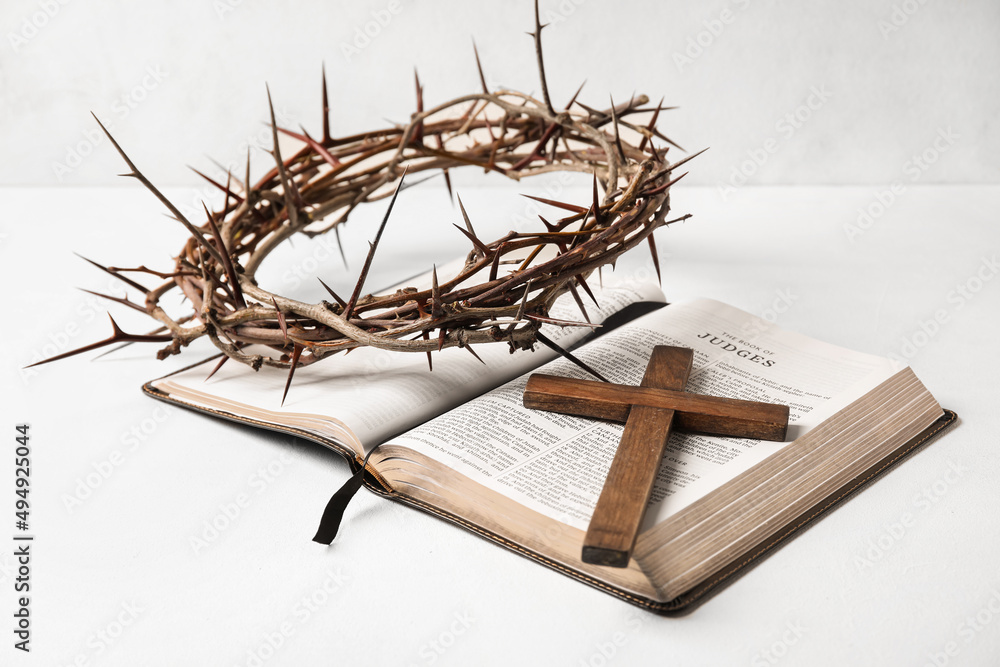 Crown of thorns with Holy Bible and cross on white background Stock ...