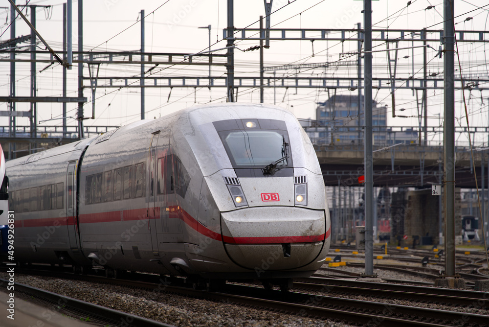 DB ICE train and SBB train passing railway station Zürich Hardbrücke on ...