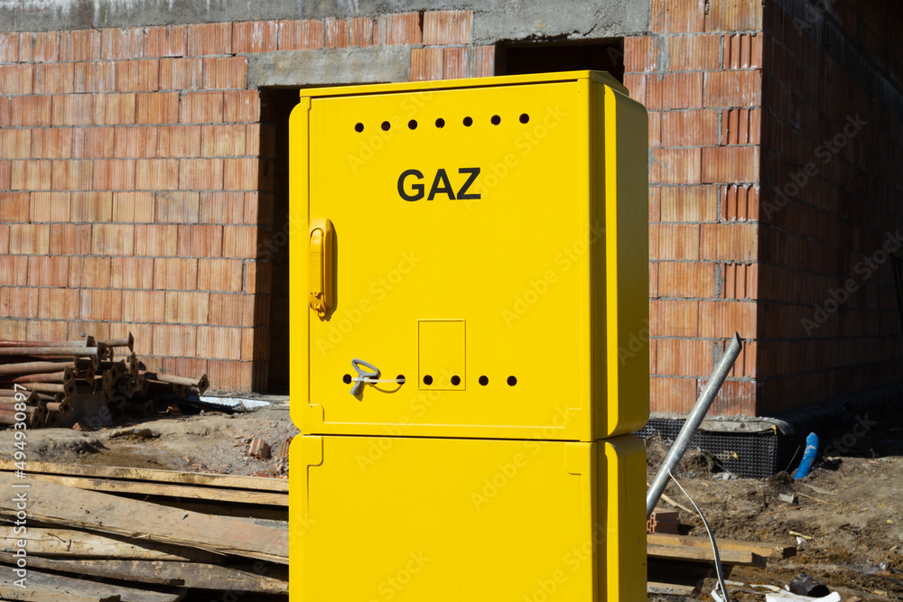 Yellow metal gas connection box at the construction site of a new ...