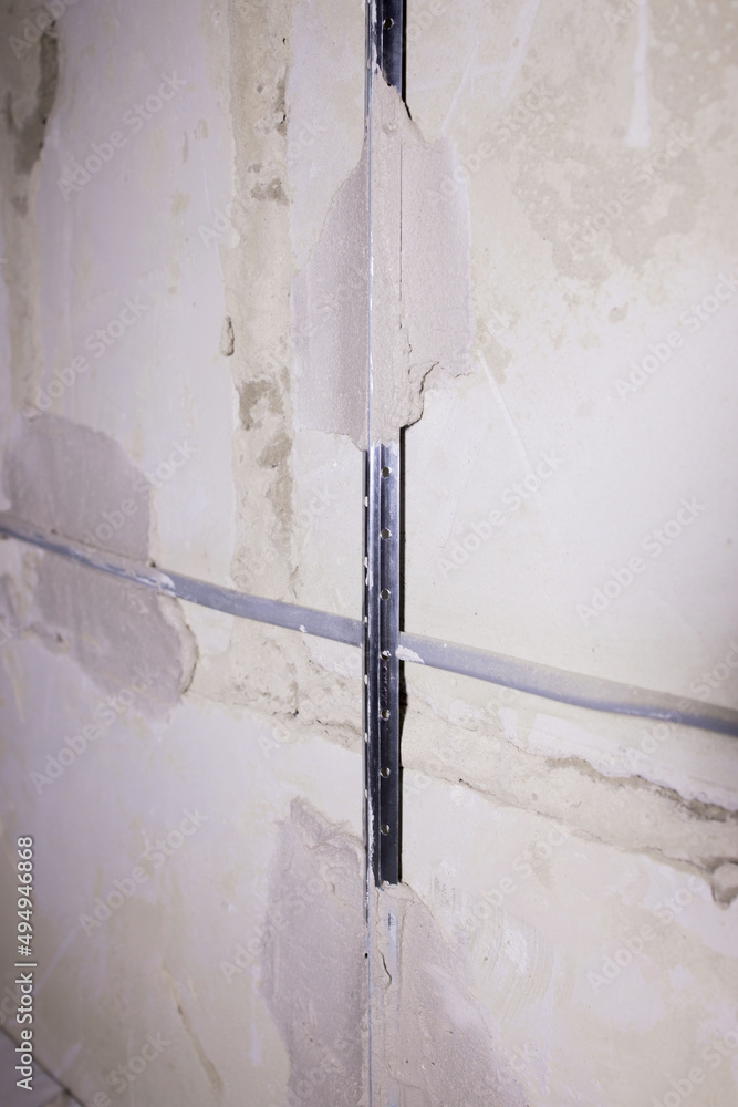 Electrical Cable laying on wall. Wiring replacement. Connecting light ...