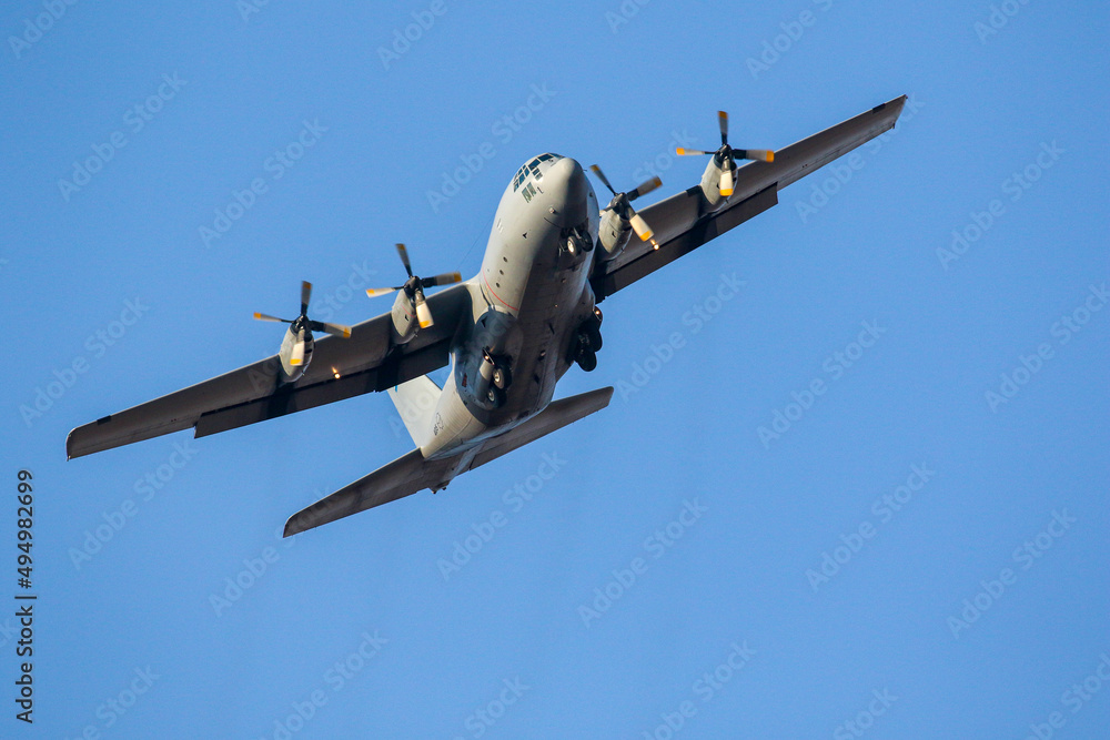 Hercules C-130 Lockheed aircraft in flight Stock Photo | Adobe Stock