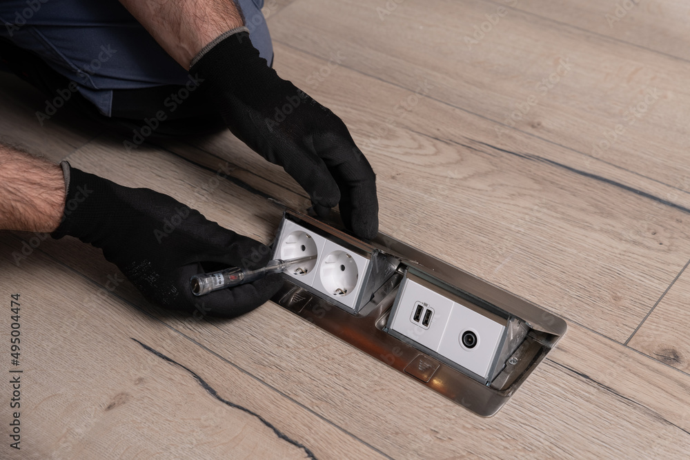installation of an open socket in the floor foto de Stock | Adobe Stock