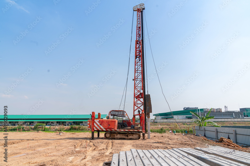 Pile driver installed piles at a construction site Stock Photo | Adobe ...