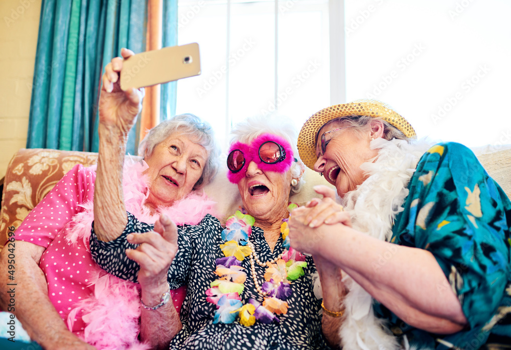 How does this thing work. Shot of a group carefree elderly people ...