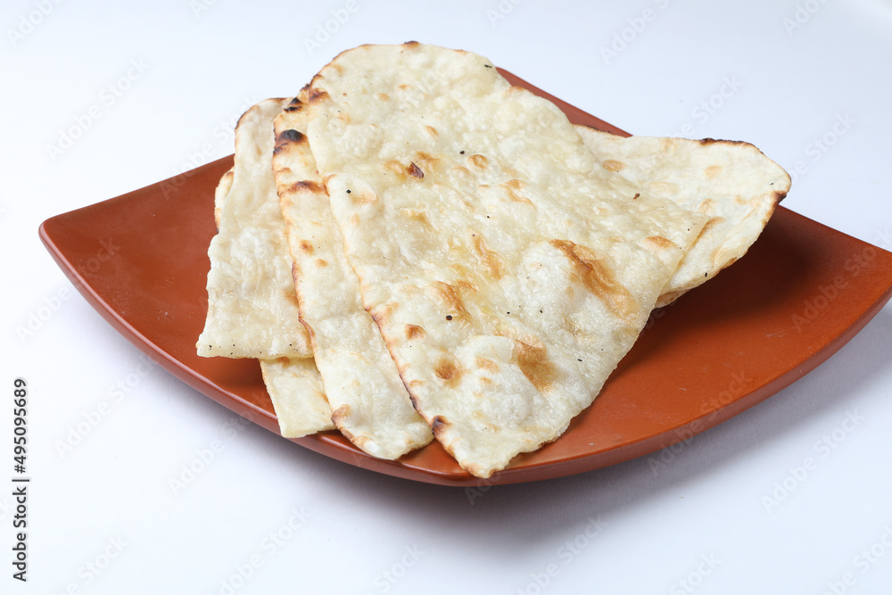 naan served in a plate, it's a type of Indian bread or roti roti/naa ...
