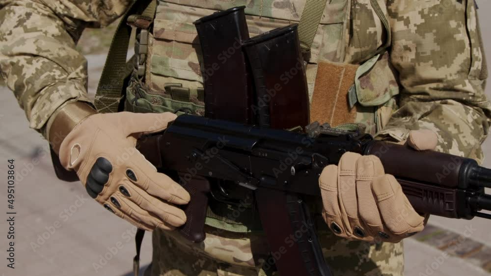 Soldier hand charging kalashnikov rifle. Assault rifle kalashnikov ...