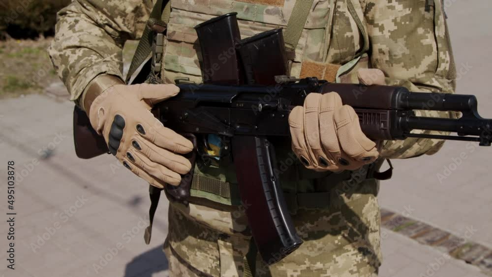 Soldier hand charging kalashnikov rifle. Assault rifle kalashnikov ...