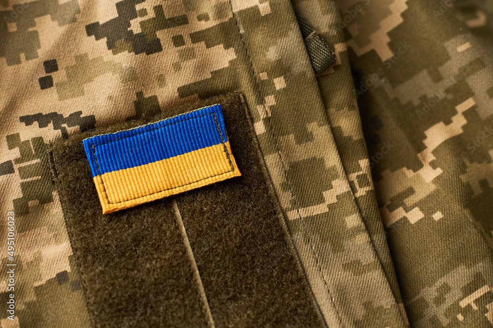 Ukraine flag and military uniform of ukrainian soldier. Armed Forces of ...