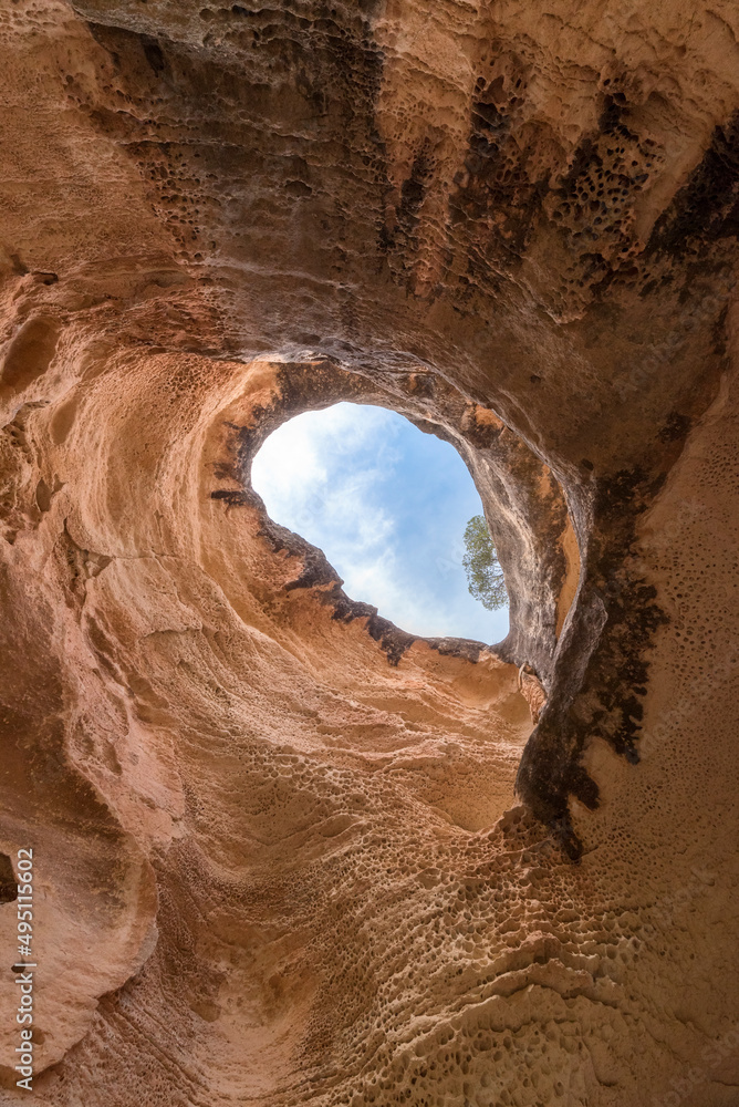 Big orange rock cave. A cave where the ancestors lived. Cave in the ...