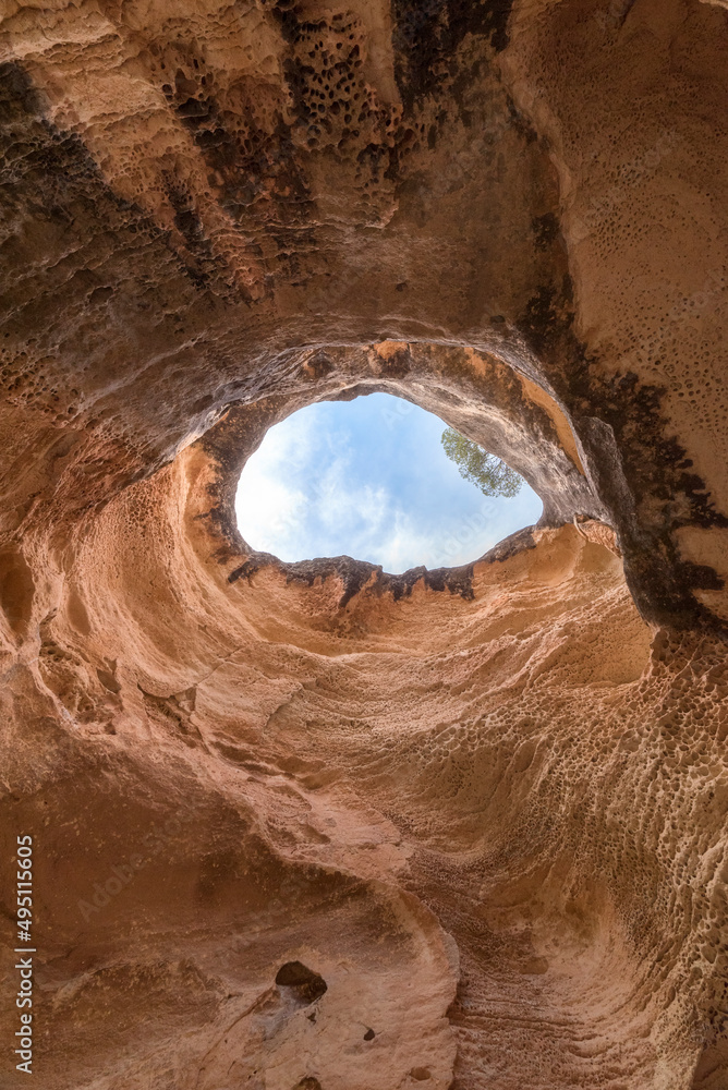 Big orange rock cave. A cave where the ancestors lived. Cave in the ...