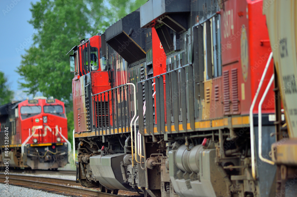 Canadian National Railway freight trains meet in a rural section of ...