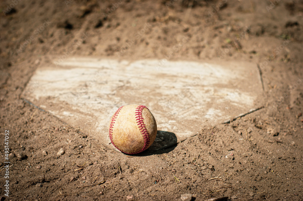 Old baseball on home plate Stock Photo | Adobe Stock