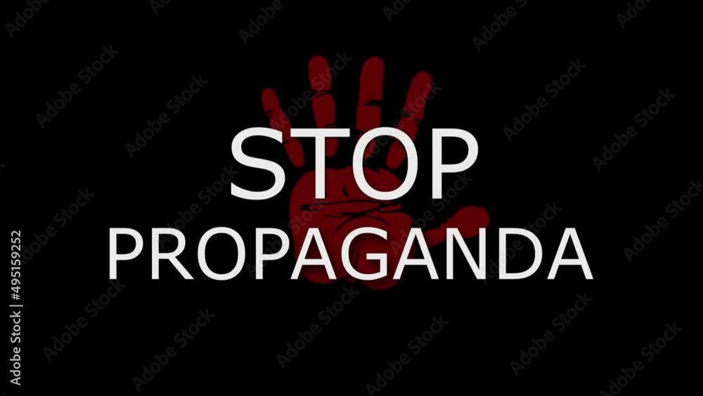 Stop propaganda text appears on screen, red hand showing stop gesture ...