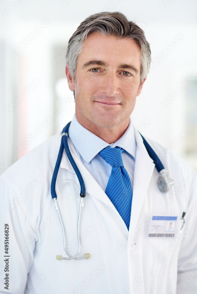 Hes the consummate medical professional. Portrait of a doctor standing ...