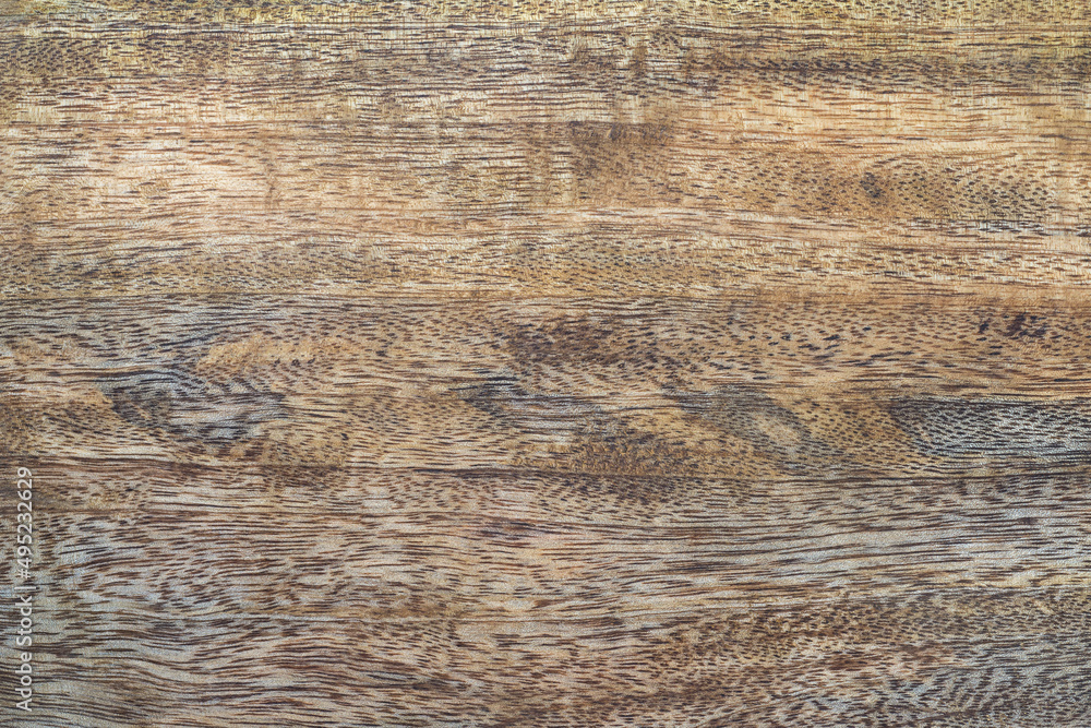 Mango wood texture with streaks of colors and mottled grain pattern ...