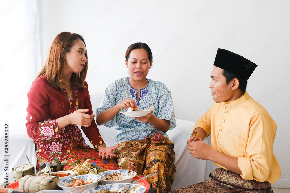 A picture of family having gathering during "Hari Raya Aidilfitri ...