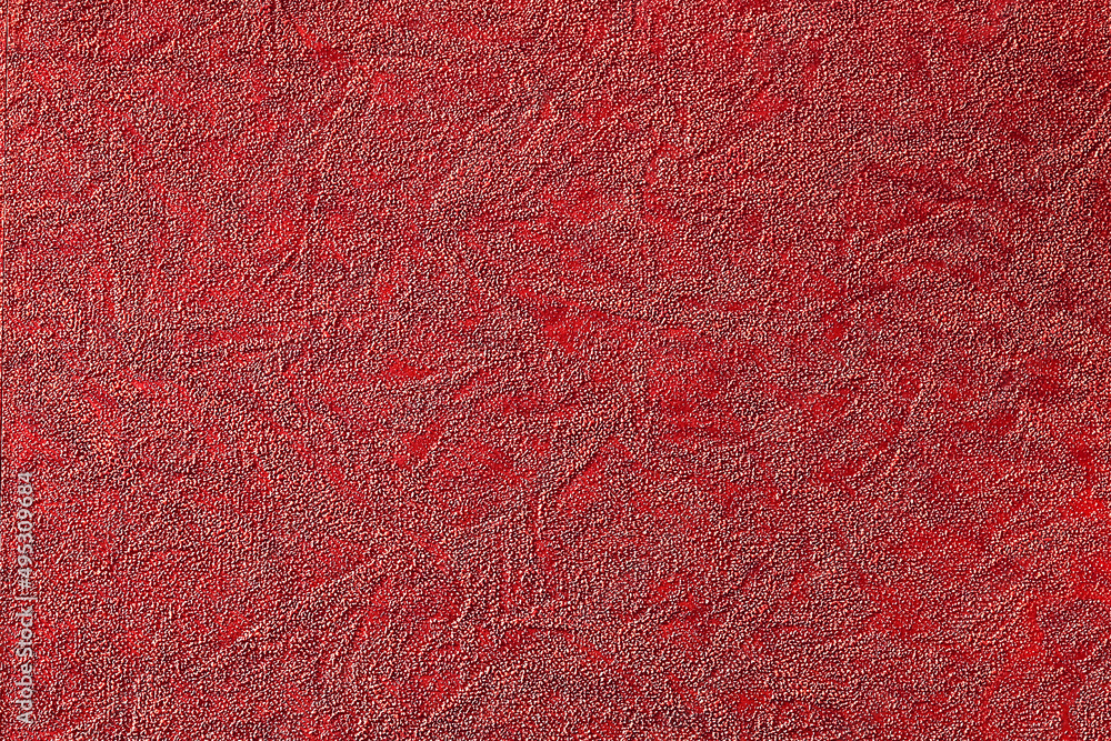 Red background with abstract pattern of various shapes, fabric and ...