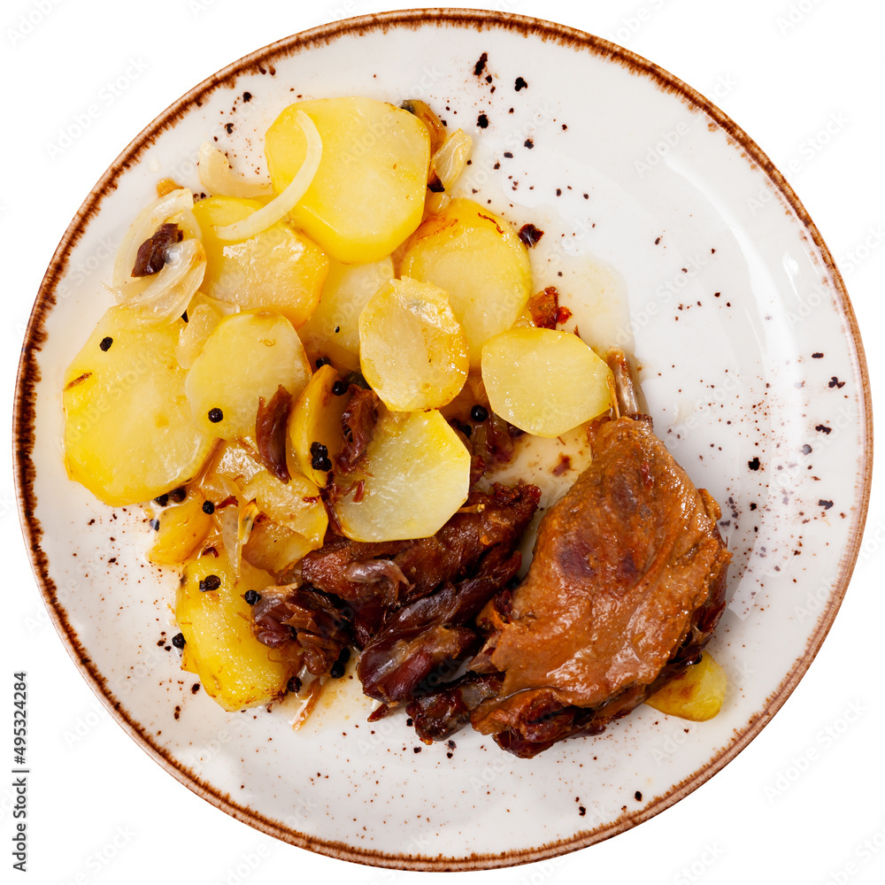 Just cooked portion of duck confit with fried poatoes. Isolated over ...